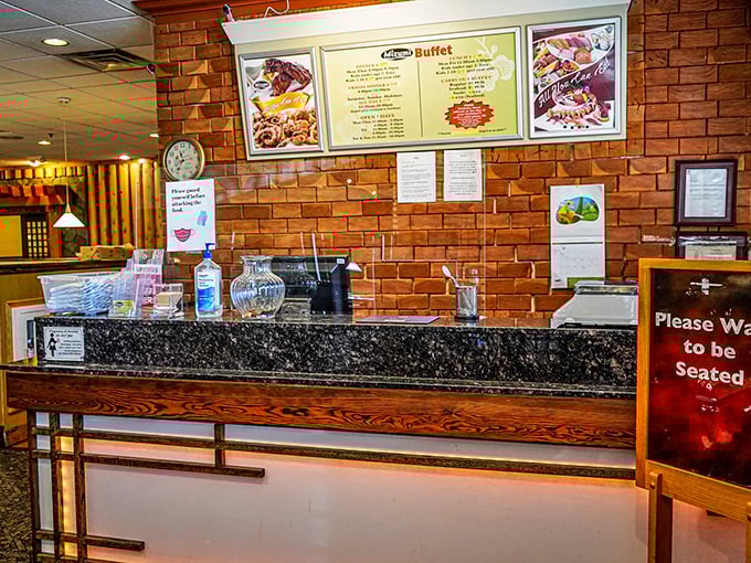 The host station—your gateway to abundance. That "Please Wait to be Seated" sign might as well say "Prepare Your Appetite."