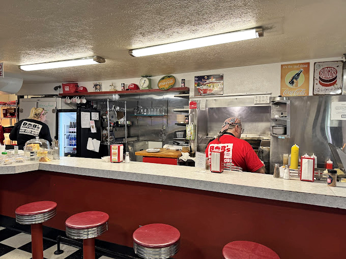 Behind this counter, culinary magic happens with spatulas that have flipped more burgers than most of us have had hot meals.