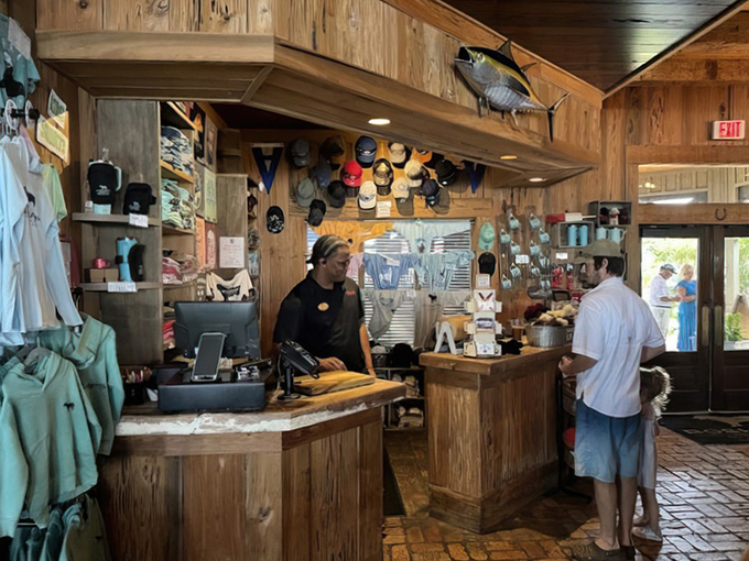 Where seafood dreams begin. This rustic counter with mounted fish overhead sets the perfect tone for coastal dining.