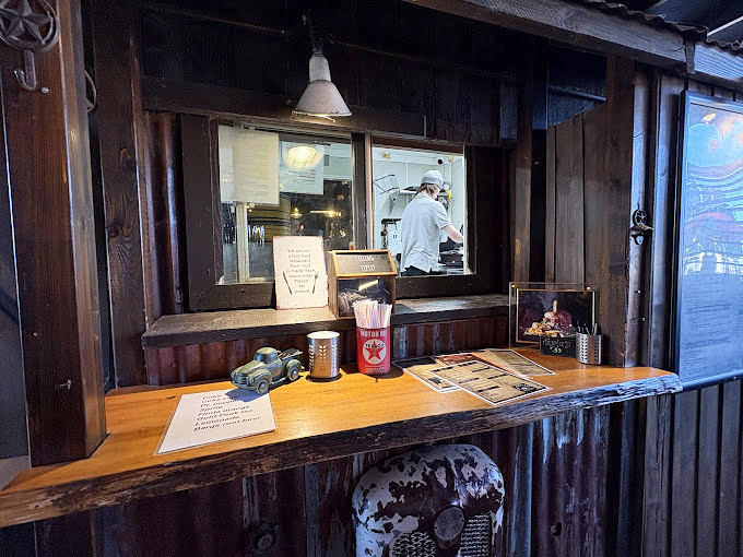 The ordering counter—that magical portal where hungry wishes transform into edible reality within minutes.