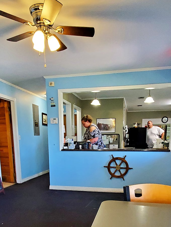 Where the magic happens – a glimpse into the kitchen pass, complete with a ship's wheel that reminds you exactly where your dinner came from.