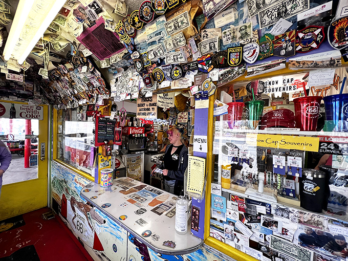 Behind this counter, jokes are served as generously as the portions. The memorabilia isn't decoration—it's a living museum of American road trips.
