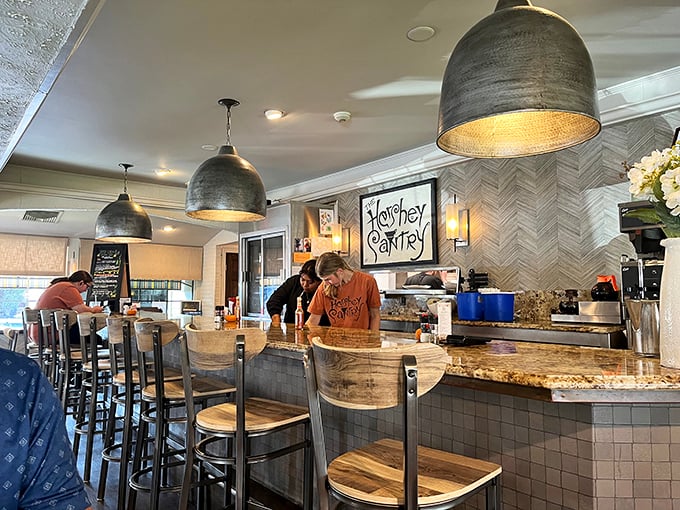 Counter seating offers front-row seats to the culinary theater where breakfast dreams become delicious reality daily.