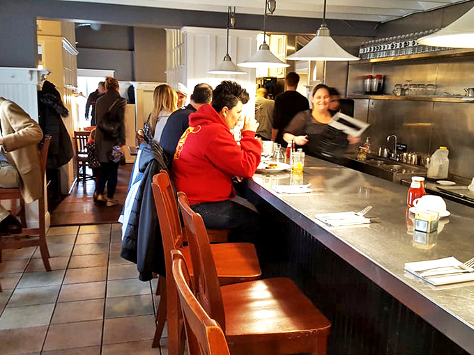 Where strangers become friends over shared maple syrup drizzles and coffee refills—the counter seating at its bustling best.