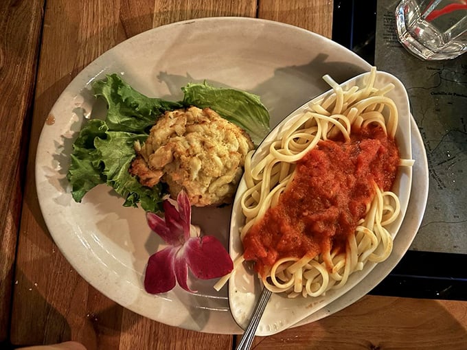 A crab cake that's actually cake-shaped and pasta with marinara—proof that the kitchen respects both traditions and your appetite.