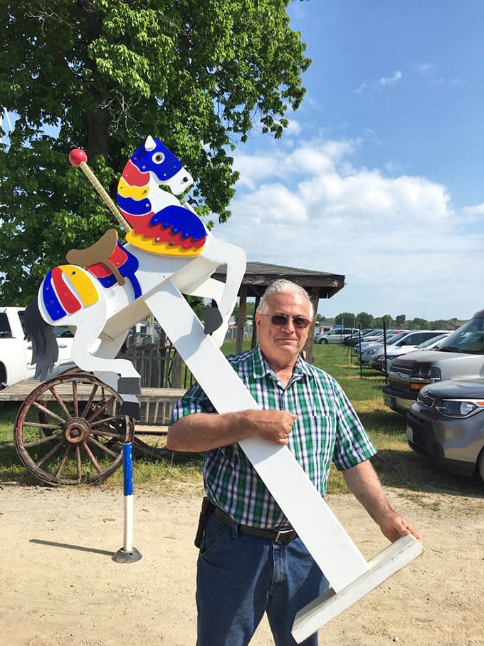 Whimsical yard art finds its forever home! This colorful carousel horse windmill is about to bring joy to someone's garden sanctuary.
