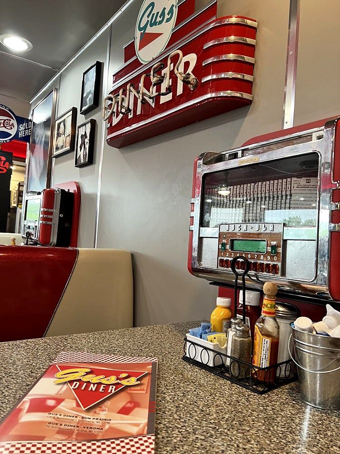 That iconic "DINER" sign above the booth tells you everything you need to know – you've arrived at the mothership of comfort food.