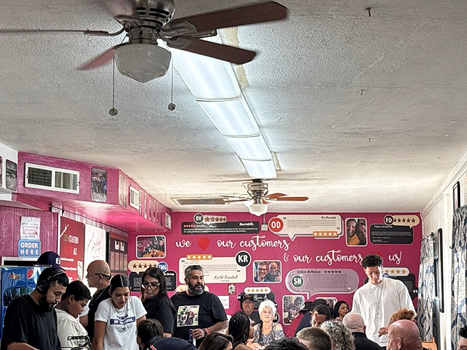A packed house tells you everything you need to know—when locals line up against that pink wall, you've found the real deal.