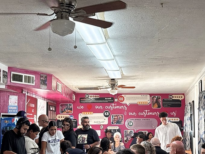 A packed house tells you everything you need to know—when locals line up against that pink wall, you've found the real deal.
