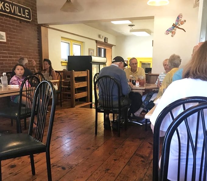 The true measure of any local eatery—tables filled with regulars who've turned this café into their second kitchen, complete with all the neighborhood gossip.