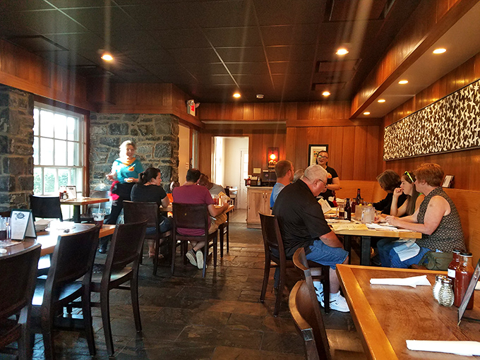 Fellow pilgrims on the BBQ journey, gathered in a wood-paneled sanctuary where the only appropriate worship is the silent nod of flavor approval.