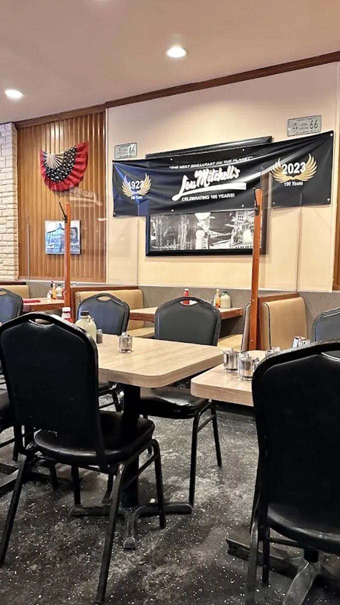 A banner celebrating 100 years of serving "the best breakfast on the planet" – a century-long streak that few restaurants can claim with such well-earned confidence.