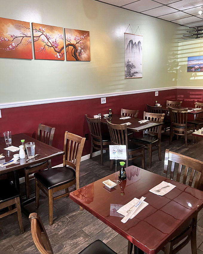 The dining room's two-tone color scheme creates a calm backdrop for the real stars – those vibrant, colorful dishes that will soon grace your table.