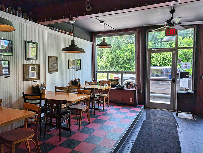 A dining room where natural light meets barbecue dreams. The checkerboard floor isn't just retro—it's the perfect backdrop for food decisions that are anything but checkered.