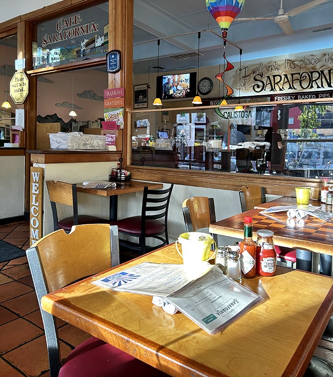 Wooden tables, pendant lighting, and a colorful hot air balloon mobile create that perfect "come as you are" atmosphere where everyone feels at home.