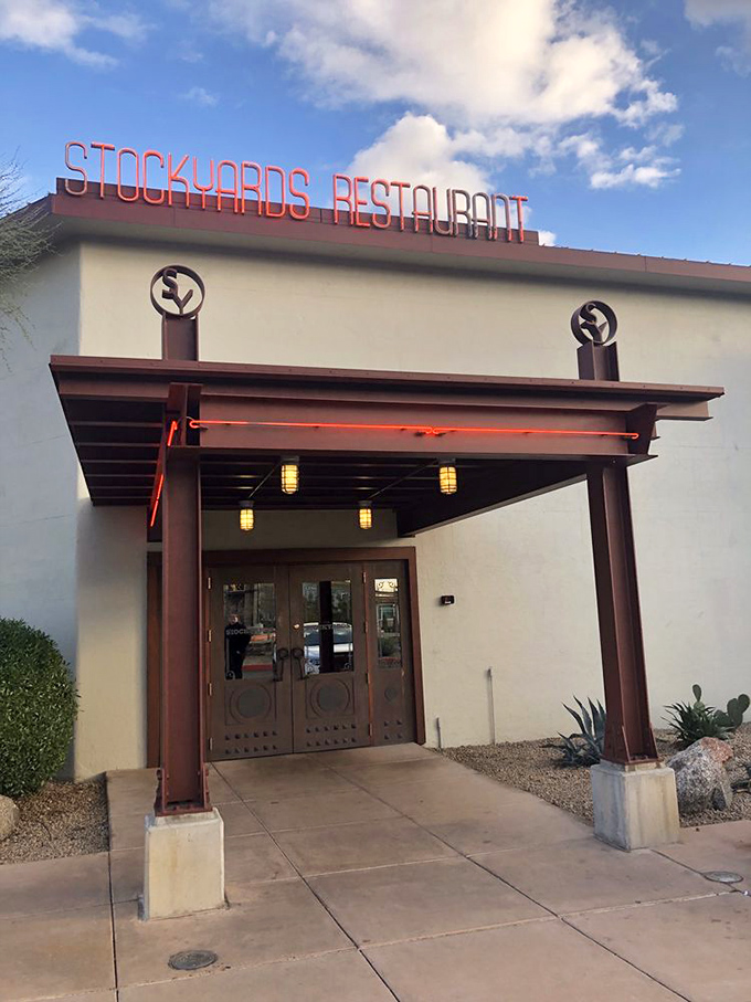 This entrance whispers "serious steakhouse" while shouting "welcome home" – the perfect combination for hungry souls.