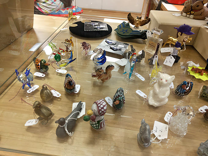 Tiny glass menagerie under lock and key—each miniature creature holds more value than its size would suggest.