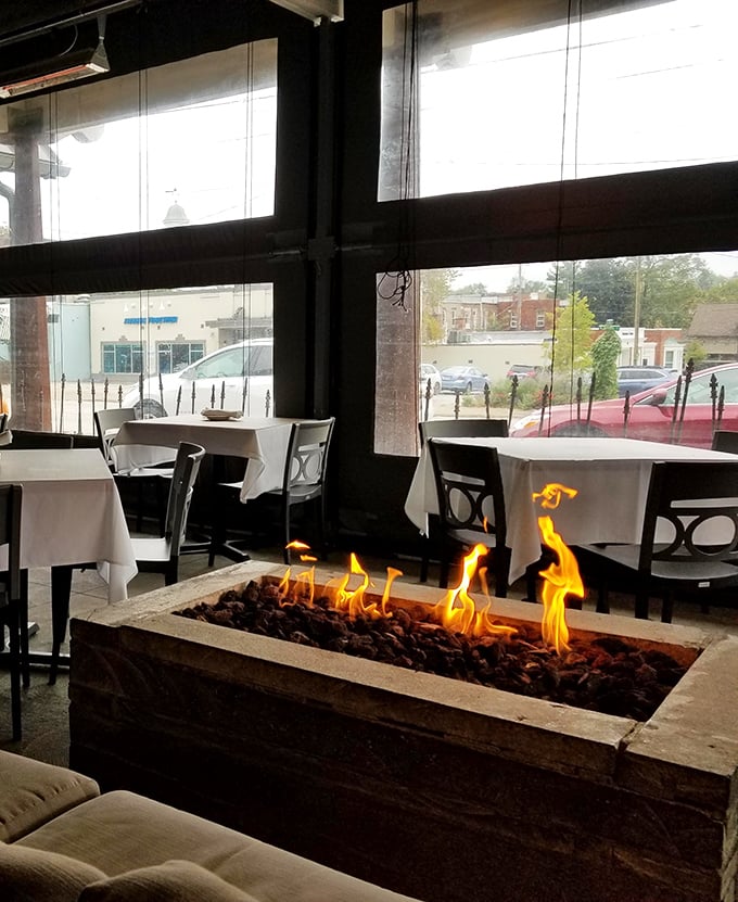 A fireplace that transforms ordinary Tuesday dinners into special occasions, proving flames aren't just for cooking—they're for ambiance too.