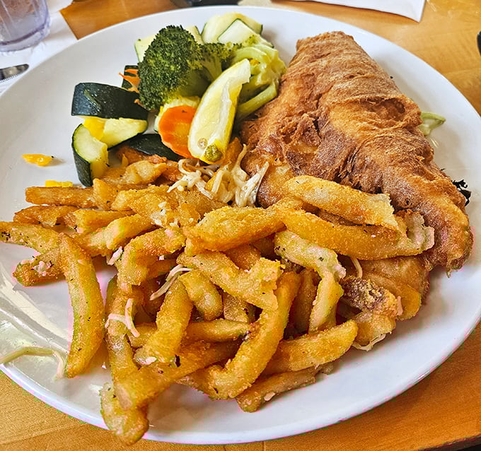 Fish and chips that would make a British pub jealous, with fries so perfectly golden they deserve their own Florida sunshine metaphor.
