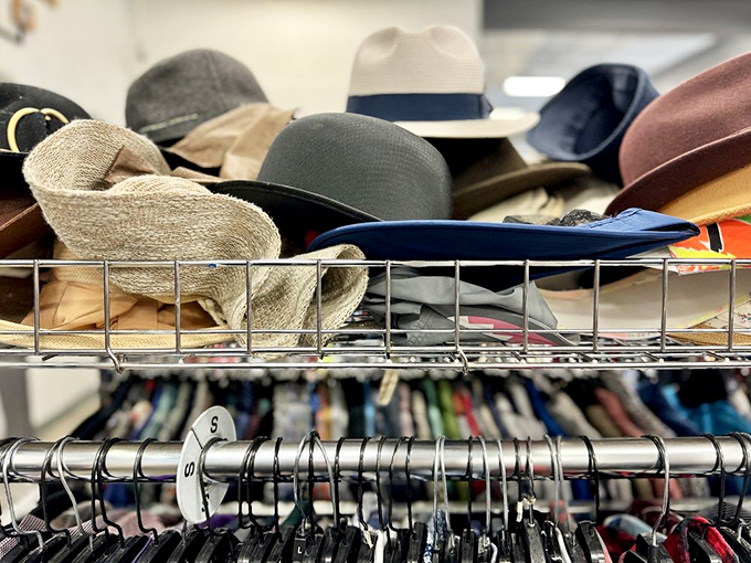 The hat section: a crowning glory of headwear where fedoras, sun hats, and beanies await their chance to top off the perfect thrifted ensemble.