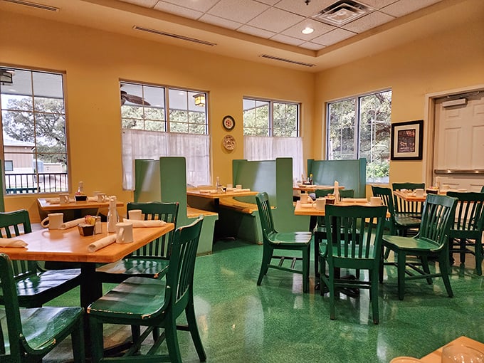 Green chairs against warm wood tones create a homey atmosphere where calories don't count and breakfast is served all day.