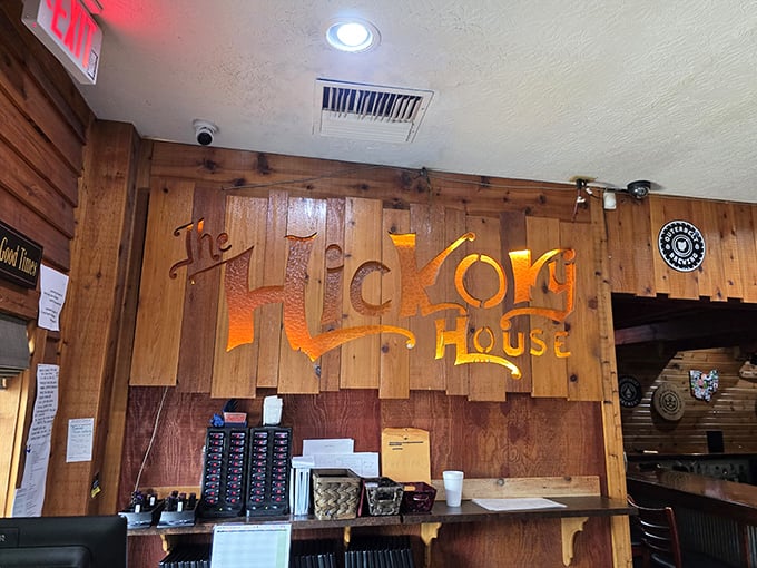 That illuminated wooden sign isn't just decoration—it's a beacon of hope for hungry travelers. Warm wood tones practically whisper "you've made the right decision."
