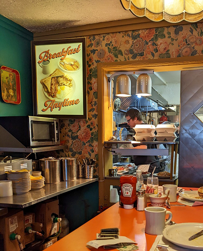 A glimpse into the kitchen – the true theater where breakfast dreams come to life amid stainless steel and decades of cooking wisdom.