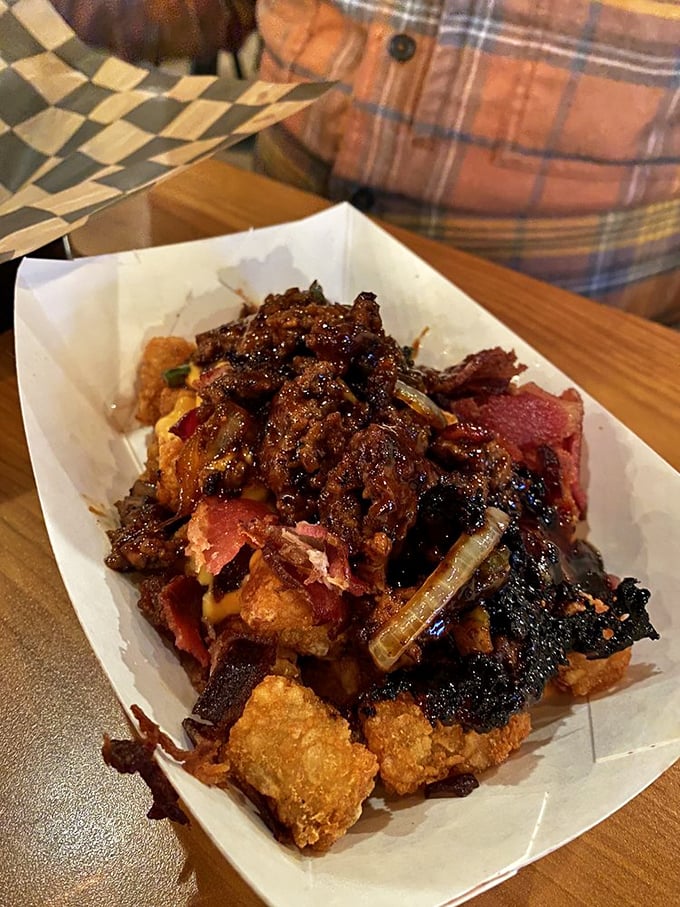When bar food ascends to art form. These loaded tots aren't just a side—they're the main event, crowned with savory toppings and melty goodness.