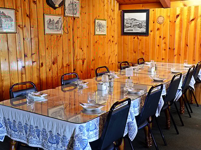 The private dining area awaits your family gathering. Those blue and white tablecloths aren't just decor—they're a promise of old-world hospitality.