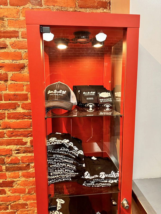 The merch display proves that Jim's isn't just a meal—it's a lifestyle worth taking home on a T-shirt or baseball cap.