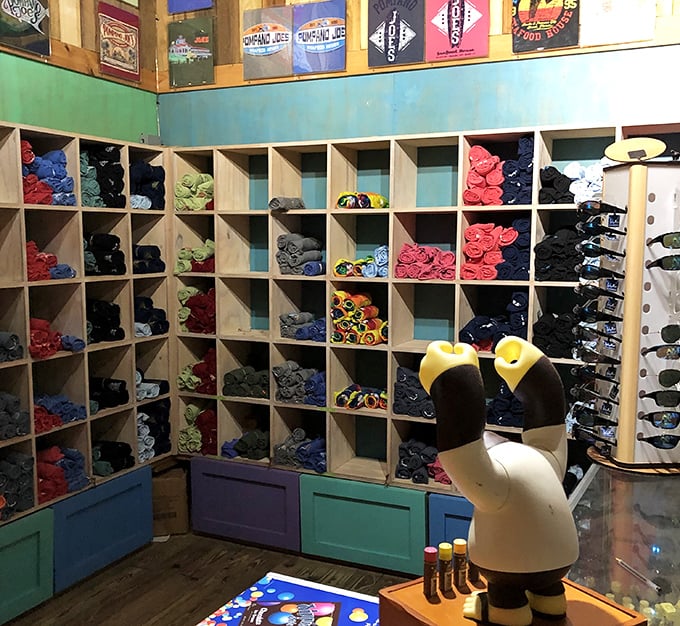 The gift shop displays more colorful t-shirts than your uncle's vacation wardrobe. That pelican statue has seen things—and is keeping all the beach secrets.