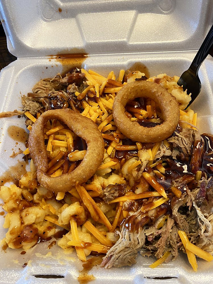The legendary Mess Plate lives up to its name in the most glorious way—pulled pork, mac and cheese, and onion rings in beautiful, delicious chaos.