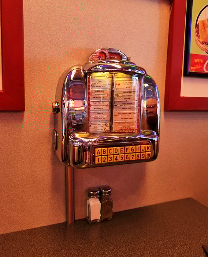 This tabletop jukebox doesn't just play songs—it's a time machine that transports you back to when music came with burgers and conversation.