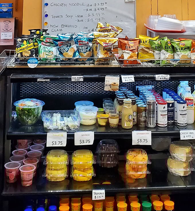 The refrigerated case offers a rainbow of puddings and fruit cups—because sometimes dessert is non-negotiable, even at lunch.