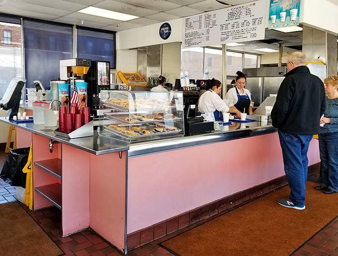 The order counter—where dreams come true and diet plans go to die. Worth every delicious calorie.