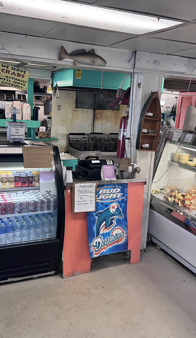 The order counter where dreams of fried seafood become reality—efficiency over elegance, and nobody's complaining about it.