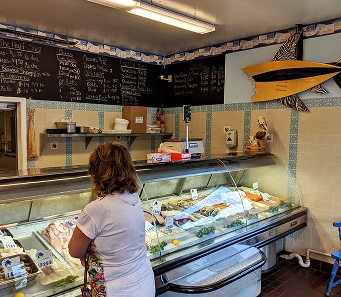The seafood market section—where glass cases display the morning's catch like jewels in an oceanic treasure chest.
