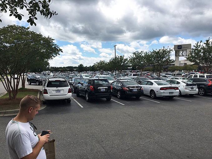 The packed parking lot tells the true story—bargain hunters know exactly where to find designer labels without designer prices.
