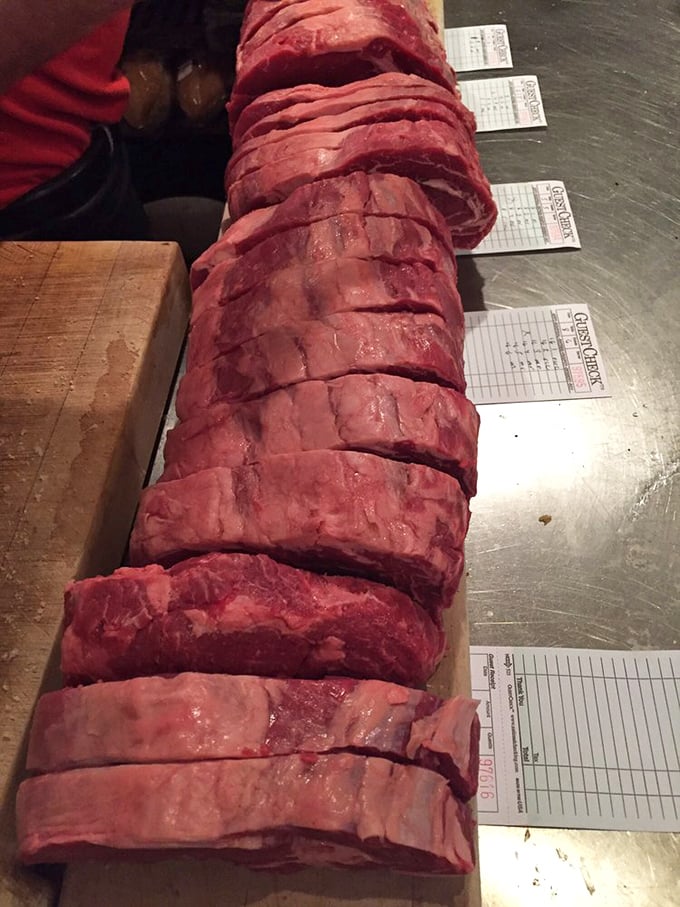 Behold the lineup of future happiness—each slice of prime beef awaiting its moment of glory on the grill.