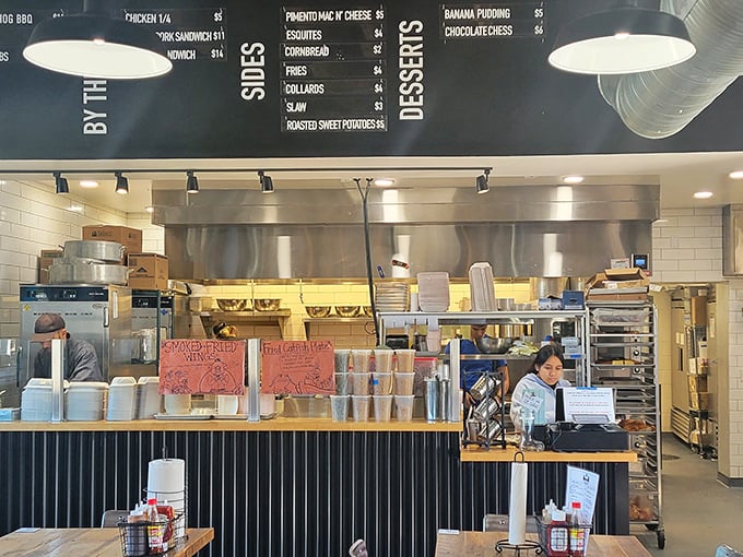 Behind the counter, where barbecue dreams become reality and the menu board tempts you with choices you'll spend days justifying.
