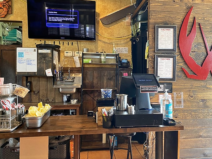 Where seafood dreams begin – the ordering counter adorned with the tools of the trade and that iconic red claw.