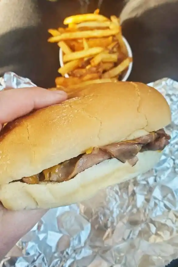 Behold the roast beef sandwich in its natural habitat—thinly sliced, perfectly seasoned, and ready to remind you why classics never go out of style.