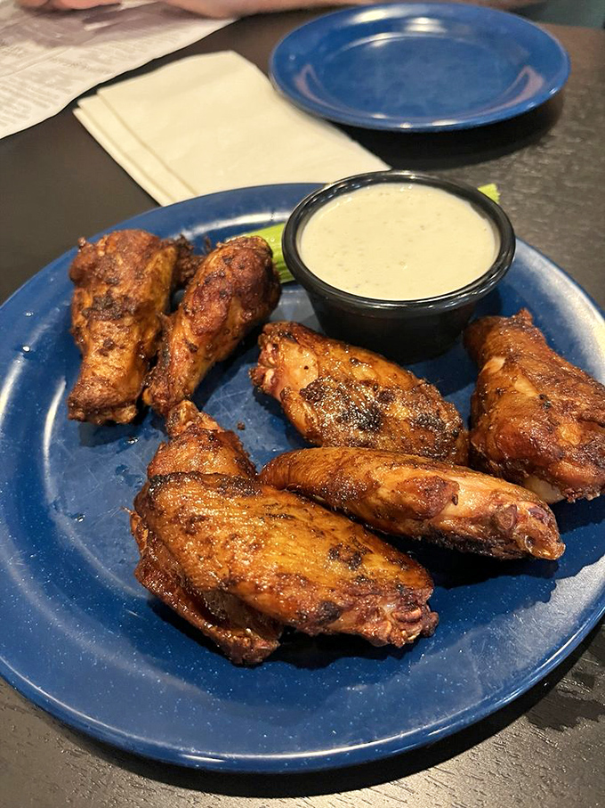 Smoked wings that render Buffalo sauce unnecessary. These wings weren't just introduced to smoke—they were immersed in its transformative powers.