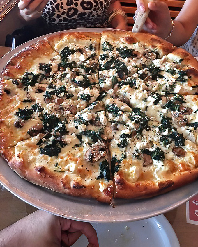 This white pizza with spinach and feta is what happens when Mediterranean flavors take a delicious Florida vacation.