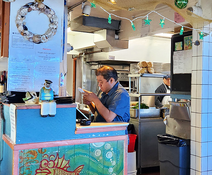 Where the magic happens—skilled hands transforming the ocean's bounty into dishes that create lifelong memories and return customers.