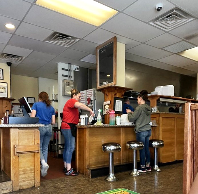 The kitchen crew orchestrating breakfast like a well-rehearsed symphony, with spatulas instead of batons.