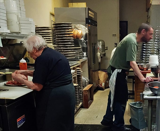 Behind the scenes, the kitchen crew works with the focused precision of orchestra members, each playing their part in the symphony of service.