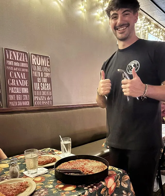 The pride on display says everything—when someone presents their pizza like they're showing off their firstborn, you know it's special.