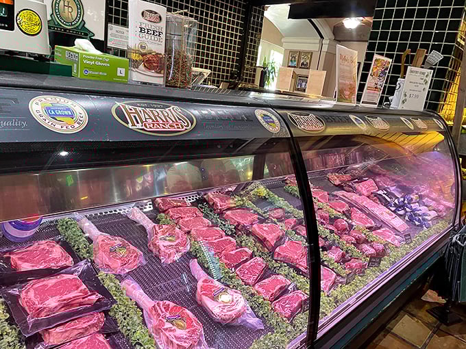 Meat heaven's display case—where steaks wait for their moment of glory. Like a jewelry store, but with significantly more protein.