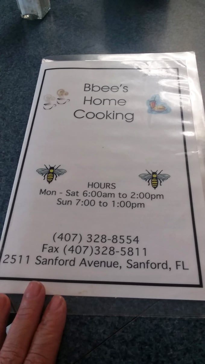 The menu cover reveals the buzz-worthy details – early bird hours ensure you'll never miss your morning French toast fix at this Sanford gem.